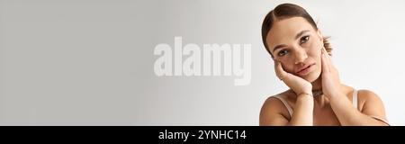 Young woman with short stature showcases an elegant style in a studio ...