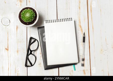 Succulent and Notebook paper in pot on table Stock Photo - Alamy