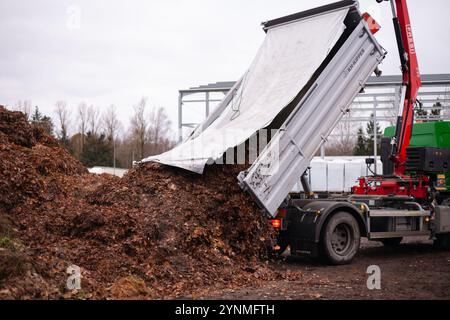 A dump truck brought new green waste for composting Stock Photo - Alamy