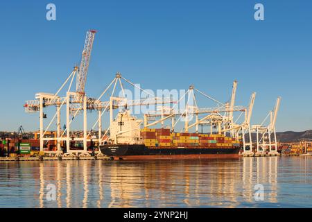 Cargo ship at the port in port Koper at night Stock Photo - Alamy
