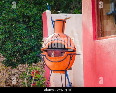 Traditional Moroccan Berber barbecue clay grill stove standing outdoors ...