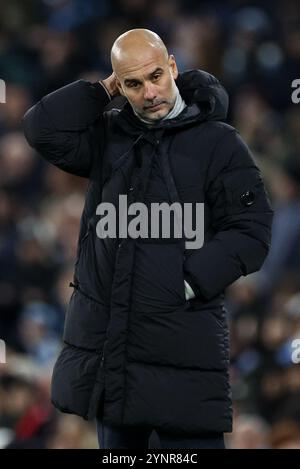 A dejected Pep Guardiola manager of Manchester City walks over to the ...
