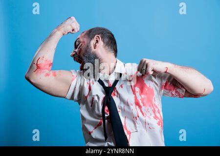 Strong man dressed as zombie covered in blood for Halloween party ...
