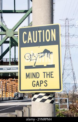 Caution mind the gaps sign on the Burlington Canal Lift Bridge in ...