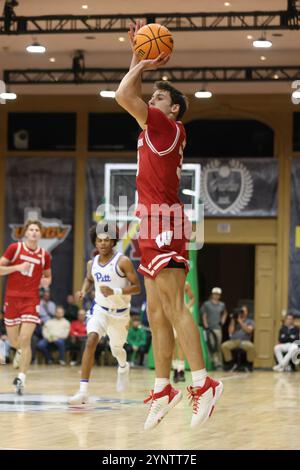 Wisconsin guard Jack Janicki (33) looks to pass on Michigan guard L.J ...