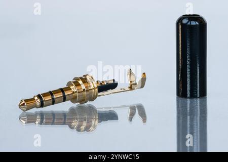 Macro shot of 4 pin gold plated mini jack connector for replacement ...