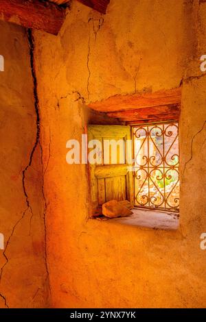 light coming through window of a derelict pise / pisé building in a ...