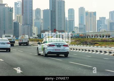 Aman taxi on the road in Sharjah City, United Arab Emirates Stock Photo ...