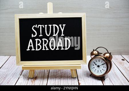 Study Abroad concept. Chalkboard on a wooden background Stock Photo - Alamy