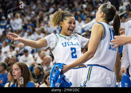 UCLA Bruins guard Avary Cain (2) right, celebrates a victory with ...