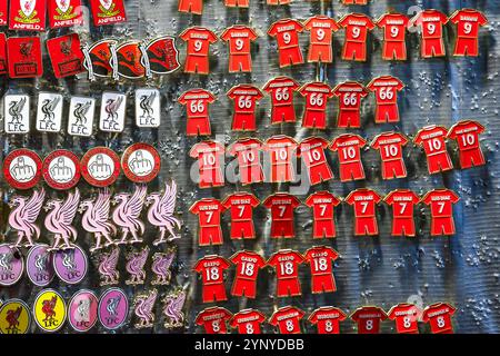 Merch stands sell badges outside of Anfield prior to the UEFA Champions ...