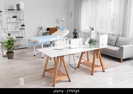 Interior of medical office with desks, couch and sofa Stock Photo - Alamy