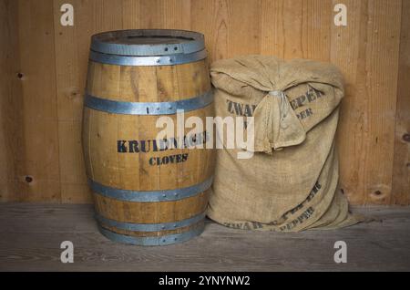 barrel with cloves and a canvas bag with black pepper Stock Photo - Alamy