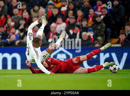 Real Madrid's Kylian Mbappe, right, scores his side's first goal ...