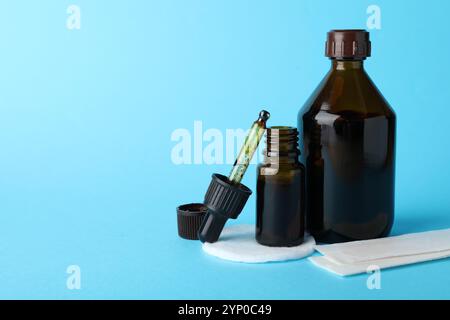 Topical iodine and bandages on light blue background Stock Photo - Alamy