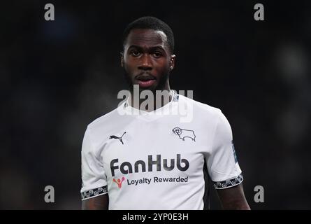 Corey Blackett-Taylor of Derby County under pressure from Ryan Longman ...