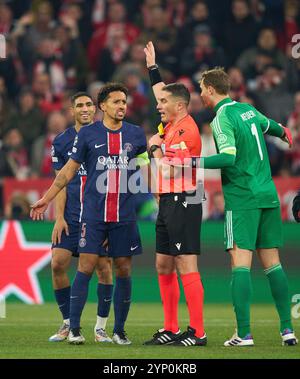 Referee Istvan Kovacs shows a yellow card during the UEFA Champions League final football match ...