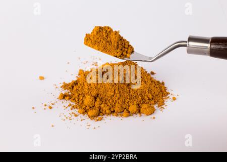 french ochre pigment on a white background Stock Photo - Alamy