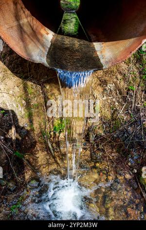 Water falling into a stream from a culvert Stock Photo - Alamy
