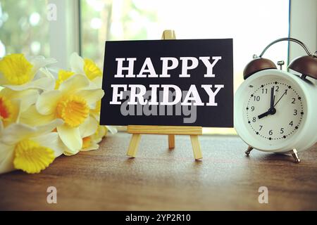 Happy Friday text on paper card with flower decoration on wooden ...