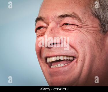 Reform leader Nigel Farage smiles during a campaign visit to Gorton and ...