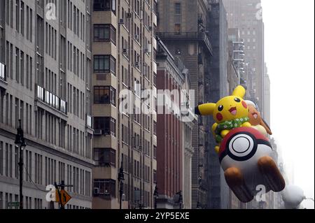 The Pikachu and Eevee balloon makes its way down the parade route as ...
