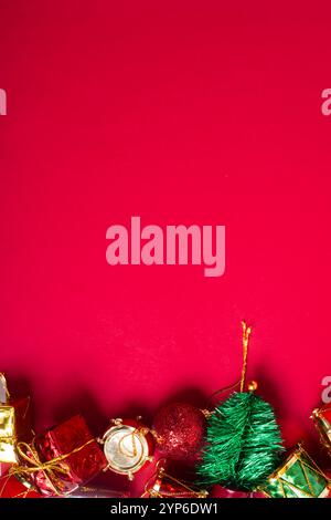 Festive wrapped gifts including a red Merry Christmas box stacked on ...