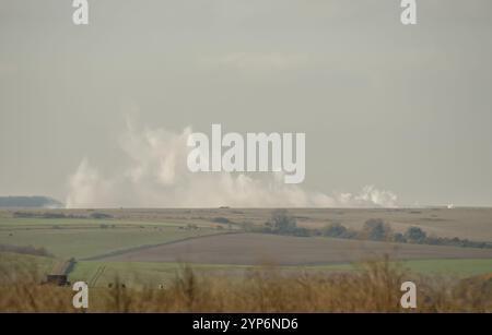 white smoke billows from artillery shell impacts Stock Photo - Alamy