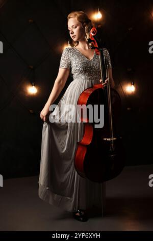 Beautiful woman cellist with her cello musical instrument Stock Photo ...