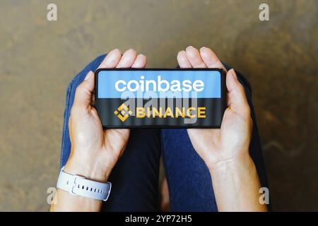 In this photo illustration, the Coinbase logo is seen displayed on a ...