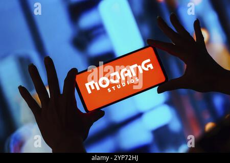 In this photo illustration, the Mojang Studios logo is displayed on a ...