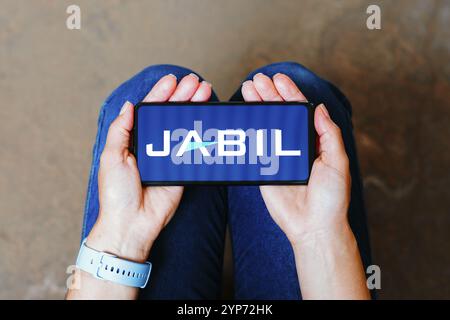 In this photo illustration, the Jabil logo is seen displayed on a ...
