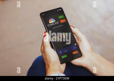 In this photo illustration Comcast Corporation logo seen displayed on a ...