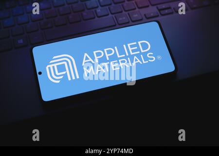 In this photo illustration Applied Materials logo seen displayed on a ...