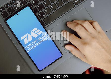 In this photo illustration, the Tencent Music Entertainment Group logo ...