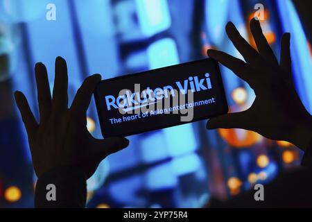 In this photo illustration, the Rakuten logo is displayed on a ...