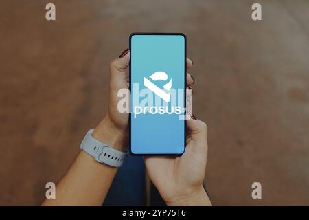 In this photo illustration, the Prosus logo is displayed on a ...