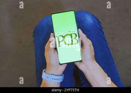 In this photo illustration, the Pendleton Community Bank (PCB) logo is ...