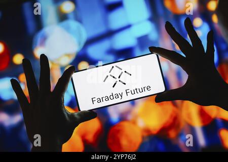 In this photo illustration, the Faraday Future logo is seen displayed ...