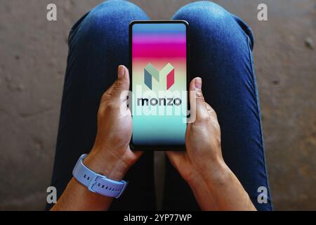 In this photo illustration, the Monzo Bank logo is displayed on a ...