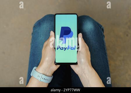 In this photo illustration, a Paypal logo is displayed on a smartphone ...