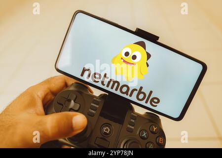 In this photo illustration, a Netmarble company logo is seen displayed ...