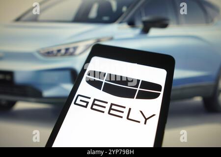 In this photo illustration, a Geely logo is seen displayed on a ...