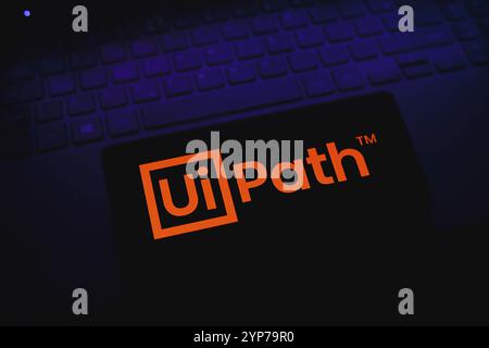 In this photo illustration, the UiPath logo is displayed on a ...