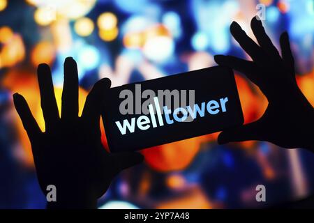 In this photo illustration, the Welltower logo is seen displayed on a ...