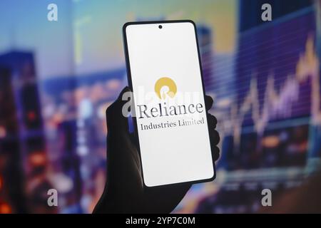 In this photo illustration, the Reliance Industries Limited logo is ...