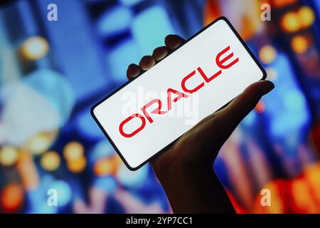 In this photo illustration, the ORACLE logo displayed on a smartphone ...