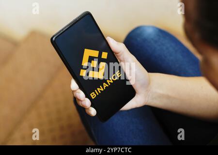 In this photo illustration, a Binance logo is seen displayed on a ...