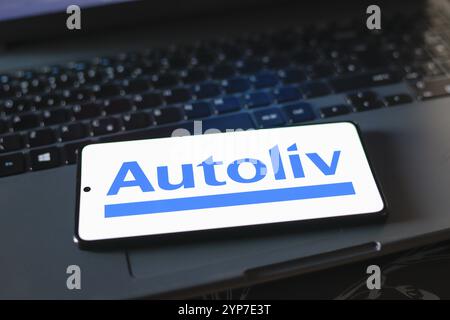 In this photo illustration, the Autoliv logo is displayed on a ...