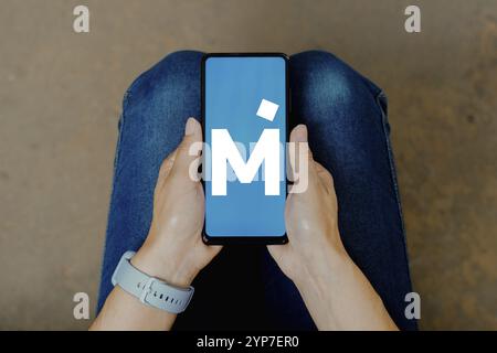 In this photo illustration, the Mercari logo is displayed on a ...